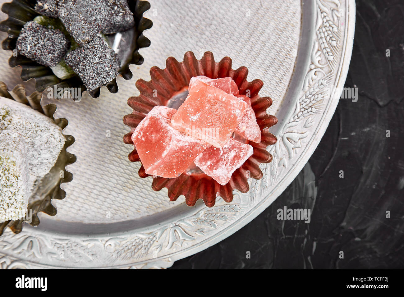 Set of various Turkish delight in traditional silver bowl on metal tray ...