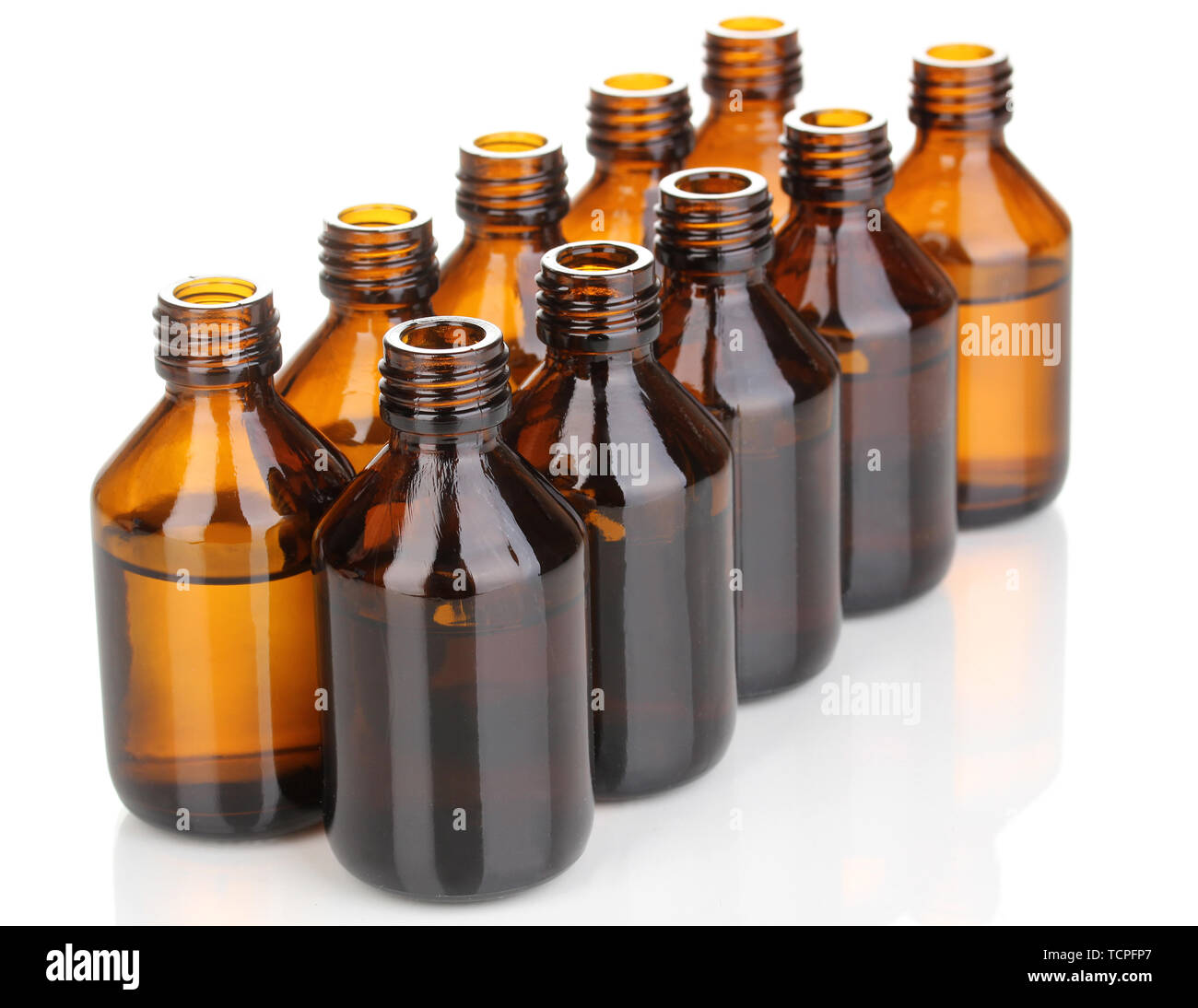 Medical bottles in the row isolated on white Stock Photo - Alamy