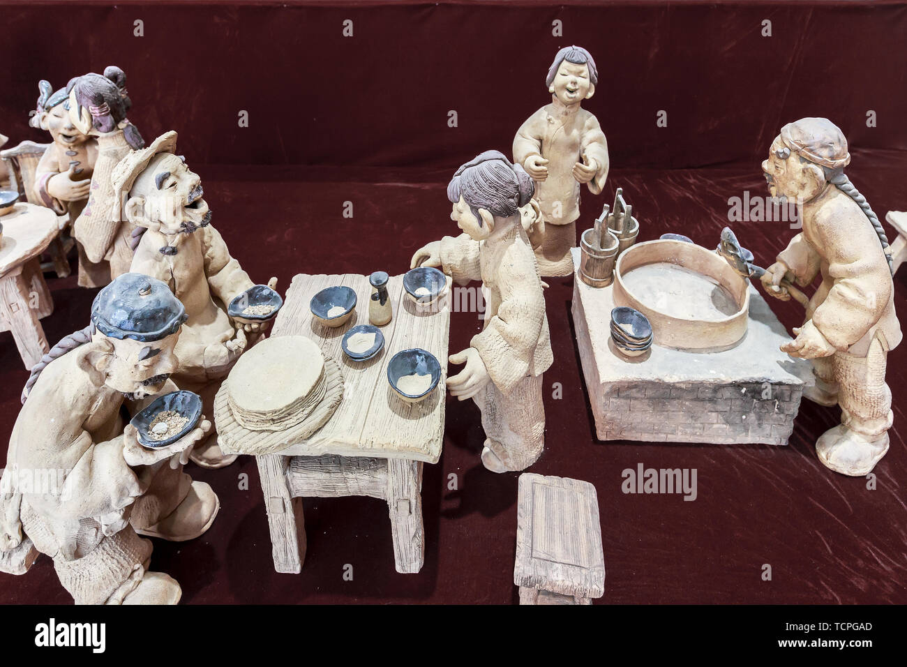 Folk life scene mud sculpture Stock Photo - Alamy