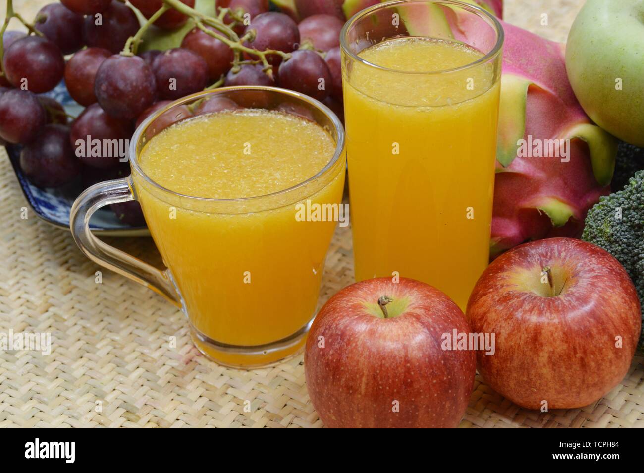 Glass orange juice lots hi-res stock photography and images - Alamy