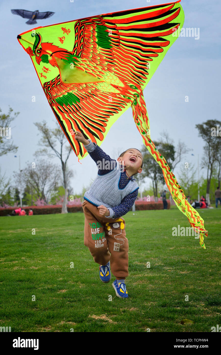 Children flying kites Stock Photo - Alamy