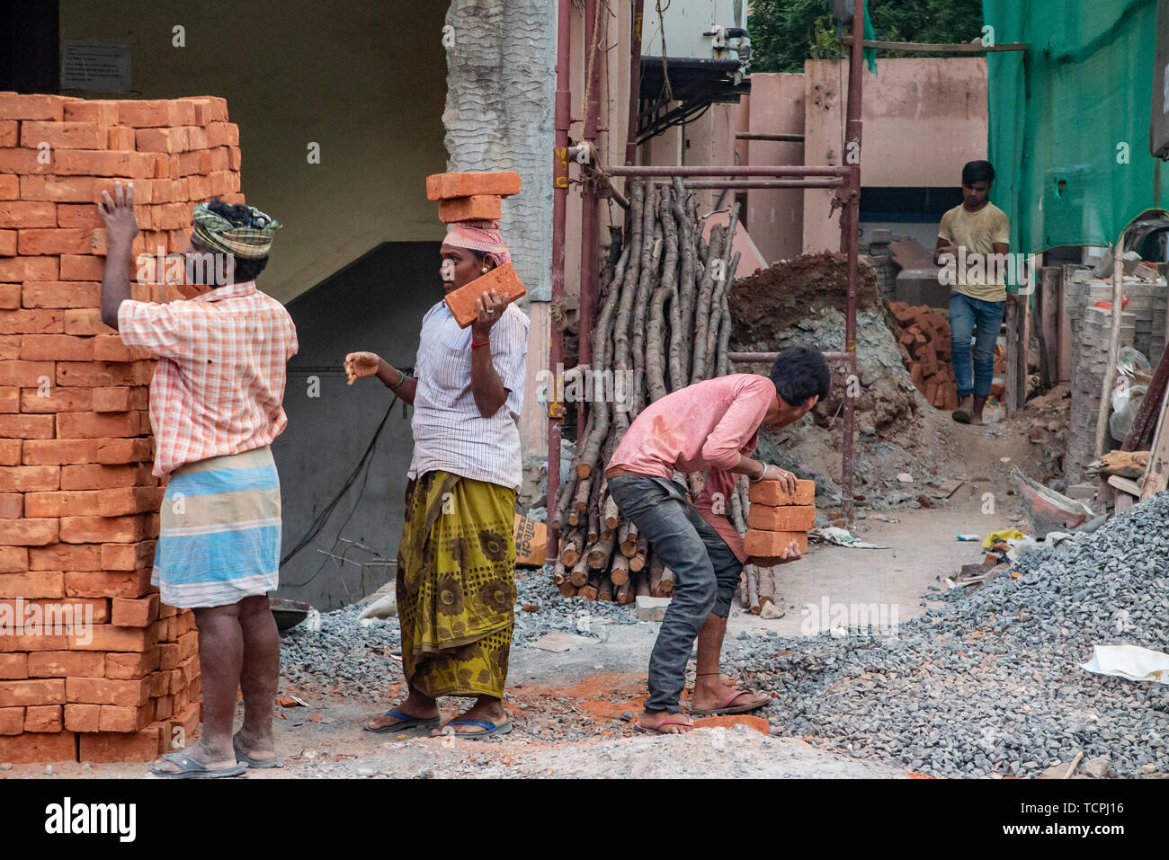 Carrying bricks on head hi-res stock photography and images - Alamy