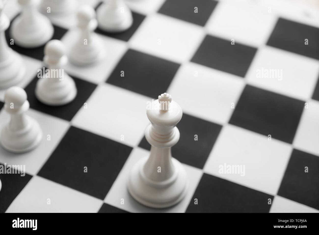 A black-and-white chess set that conveys the concepts of competition ...