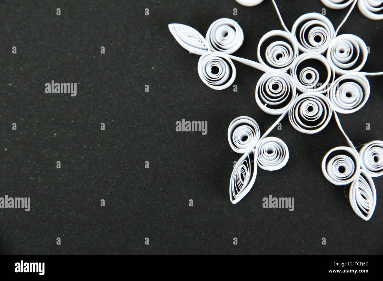 beautiful paper snowflake, on black background Stock Photo - Alamy