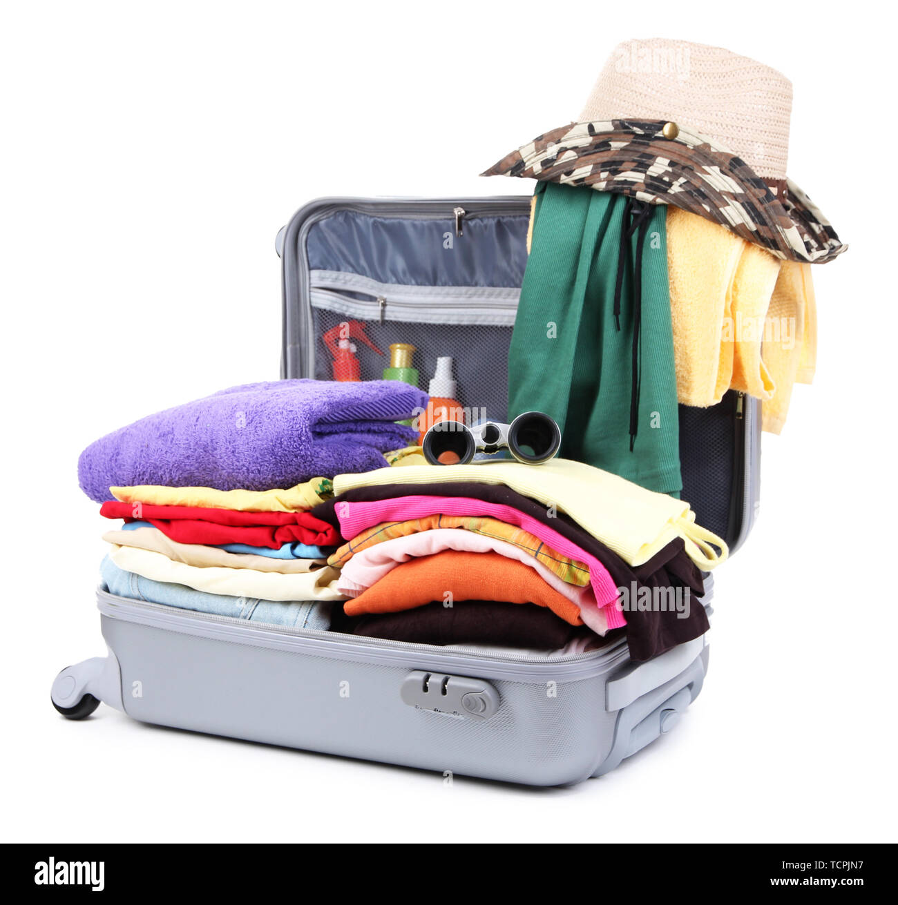 Open silver suitcase with clothing isolated on white Stock Photo - Alamy
