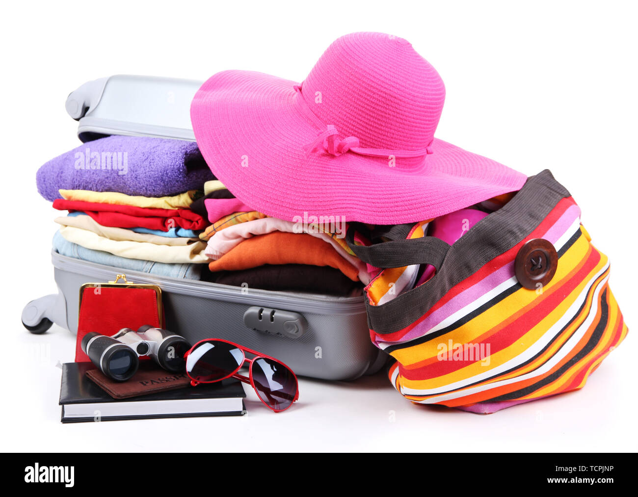 Closed silver suitcase with clothing isolated on white Stock Photo - Alamy