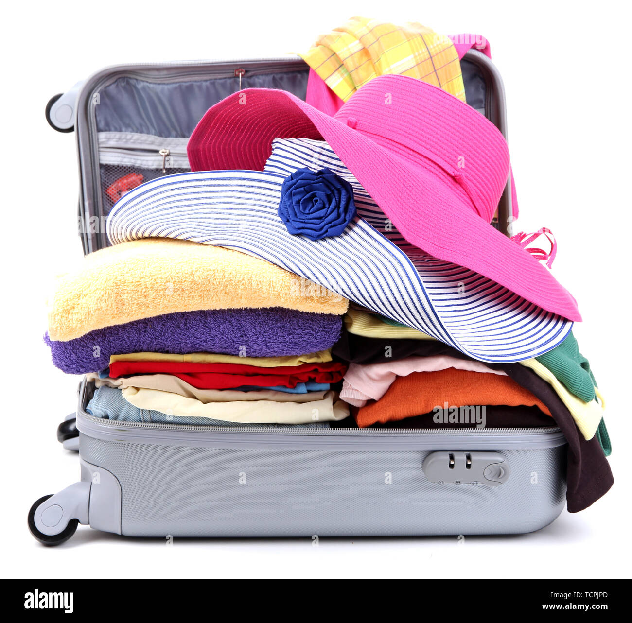 Open silver suitcase with clothing isolated on white Stock Photo - Alamy