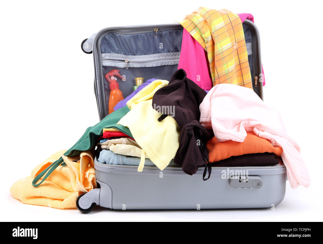 Open silver suitcase with clothing isolated on white Stock Photo - Alamy