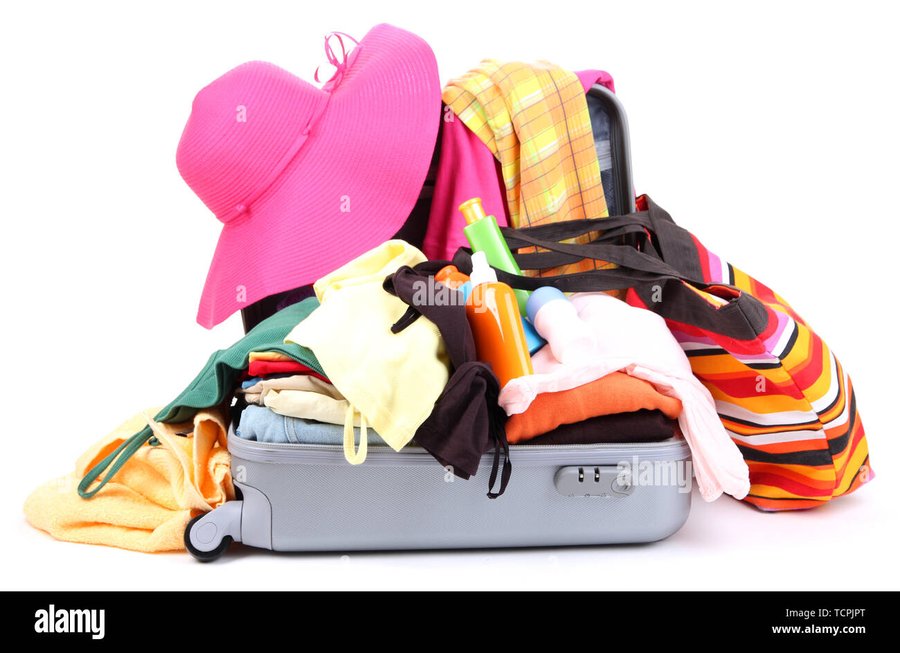 Open silver suitcase with clothing isolated on white Stock Photo - Alamy