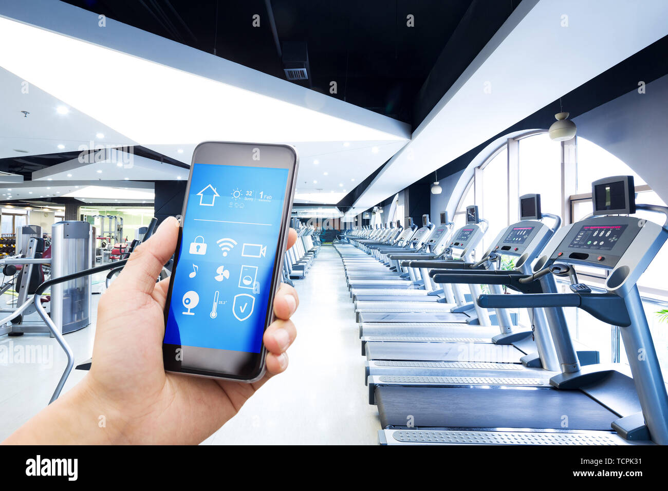 smart phone with smart home with modern gym Stock Photo - Alamy
