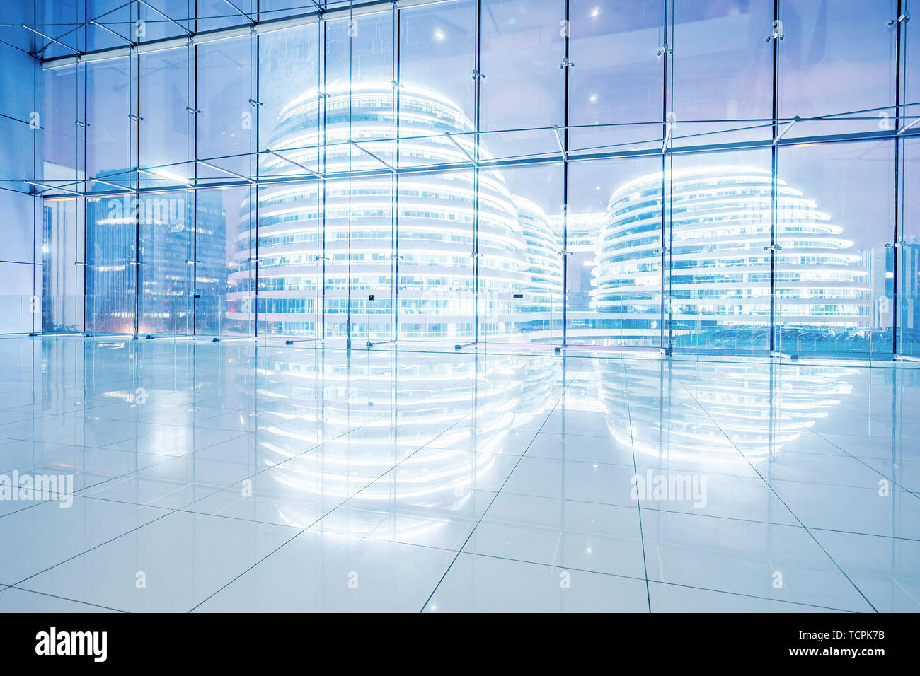 night scene of modern buildings through windows Stock Photo - Alamy