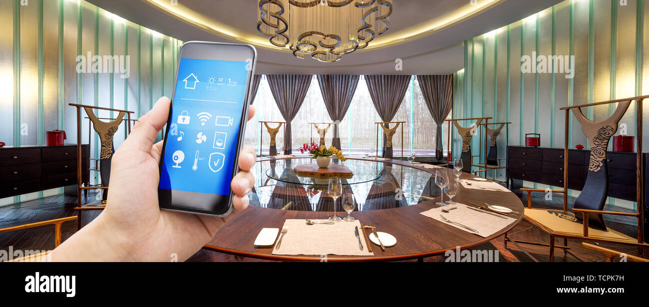 smart phone with smart home with modern dining room Stock Photo - Alamy