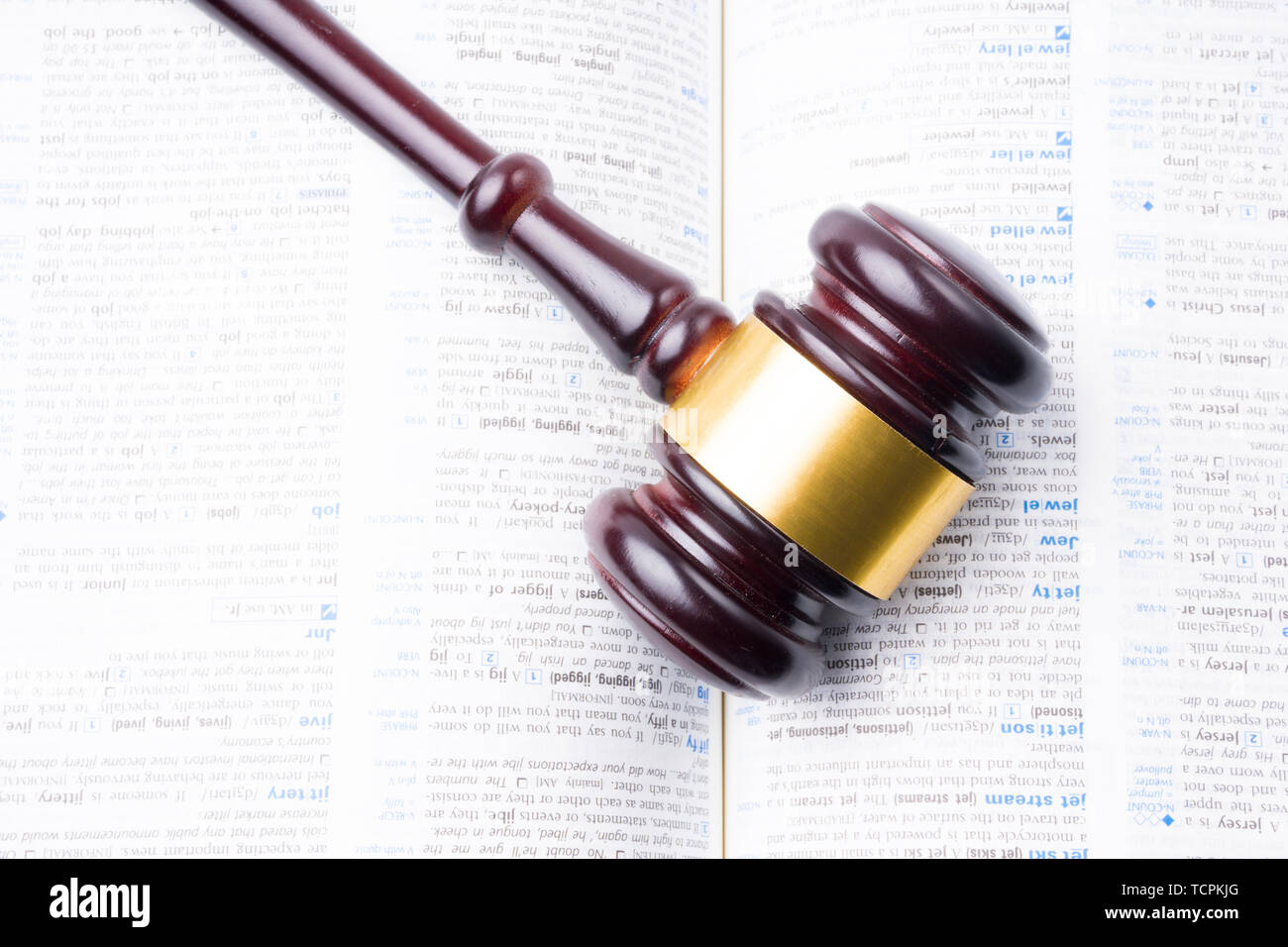 Judge hammer lay on book Stock Photo - Alamy