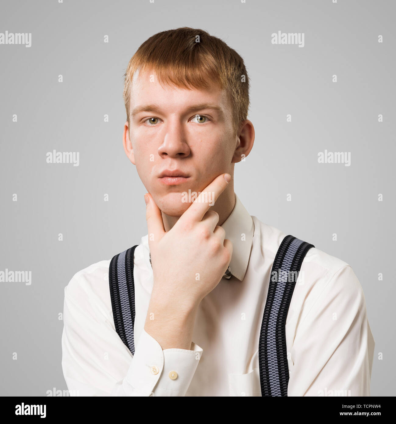 Boy having serious and calm face Stock Photo - Alamy