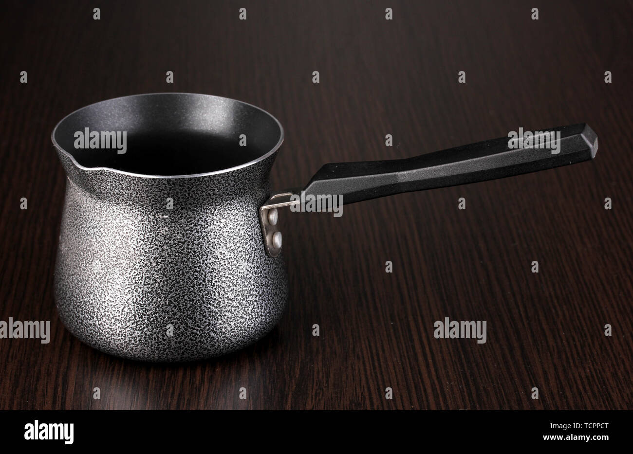 Coffee maker on brown table Stock Photo - Alamy