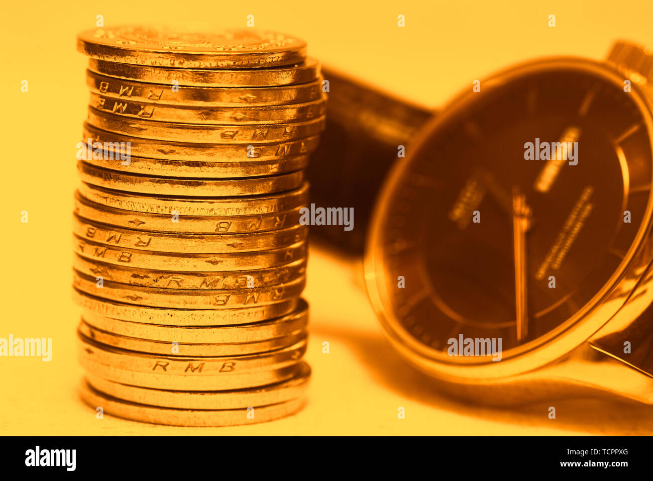 Coin with imaginary watch Stock Photo - Alamy