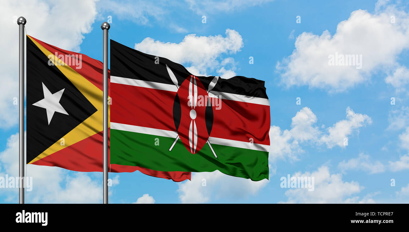 East Timor and Kenya flag waving in the wind against white cloudy blue ...