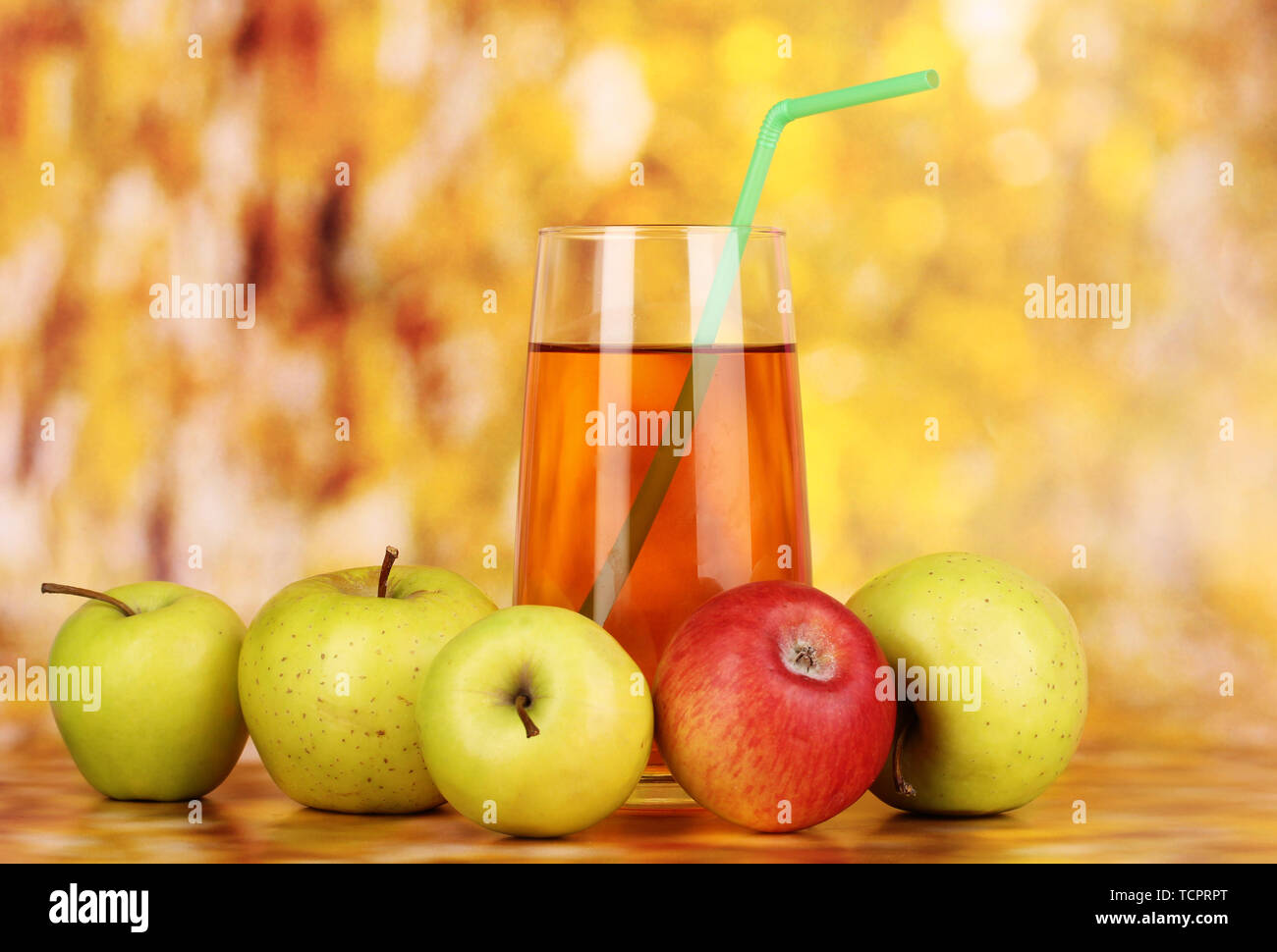 Useful apple juice with apples around on autumn background Stock Photo ...