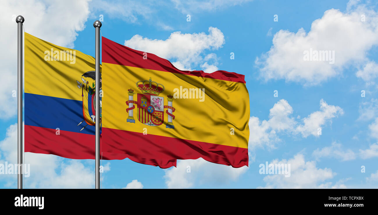 Ecuador and Spain flag waving in the wind against white cloudy blue sky ...