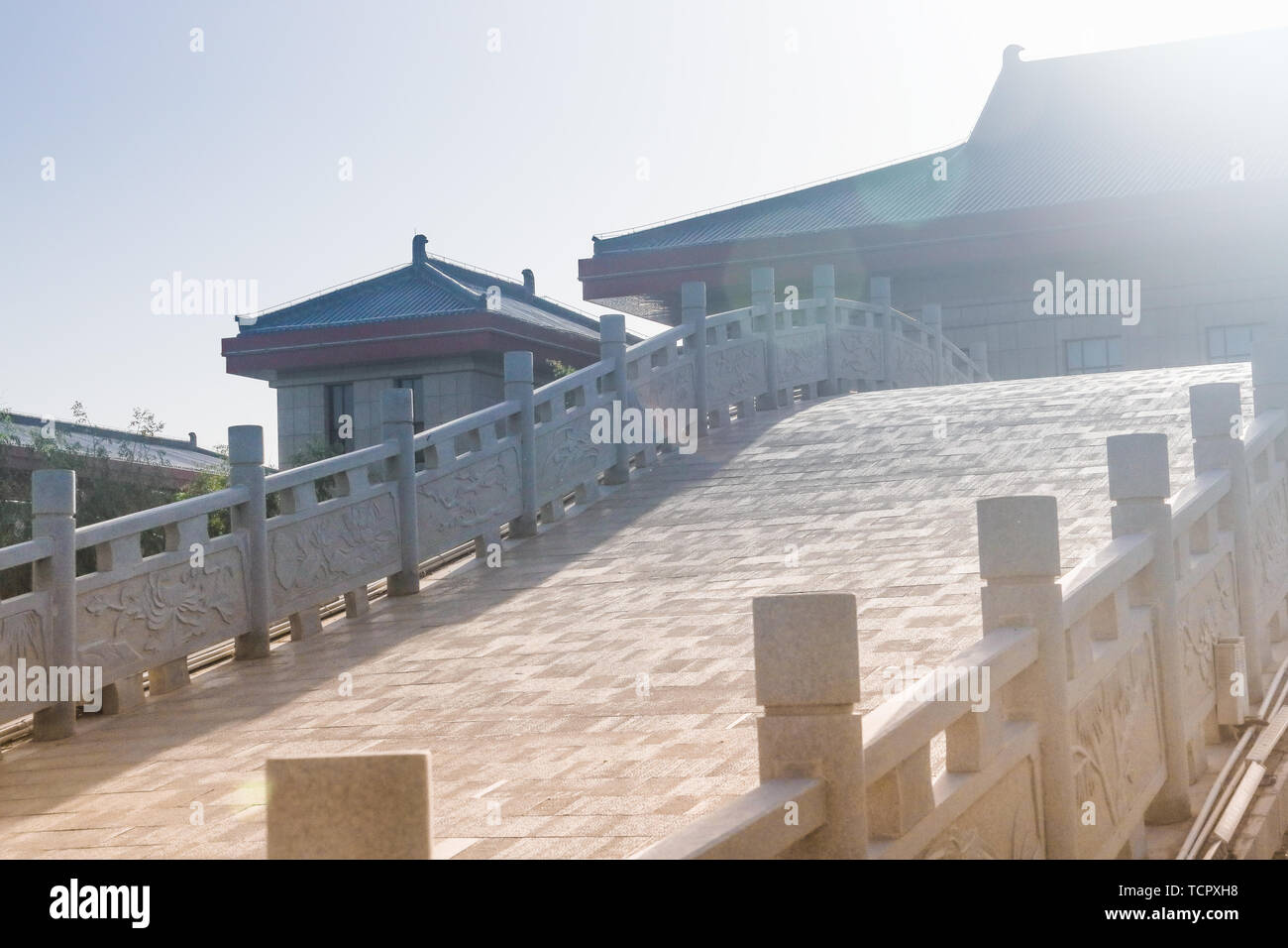 Stone bridge railings in backlight with palace Stock Photo - Alamy