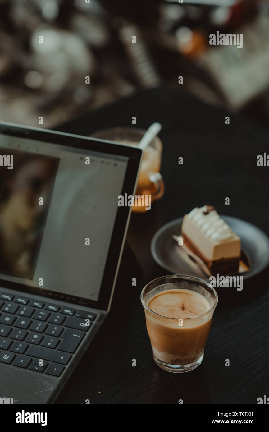 Outdoor tabletop with drinks, desserts and computers Stock Photo - Alamy
