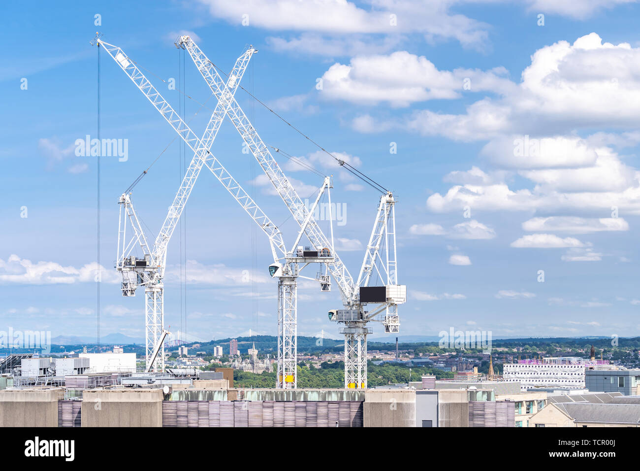 Construction crane working in construction site Stock Photo - Alamy