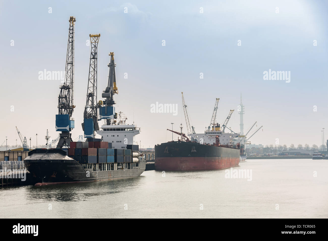 Big Cargo Containers Boat with Goods cargo Stack at the Pier docks port ...