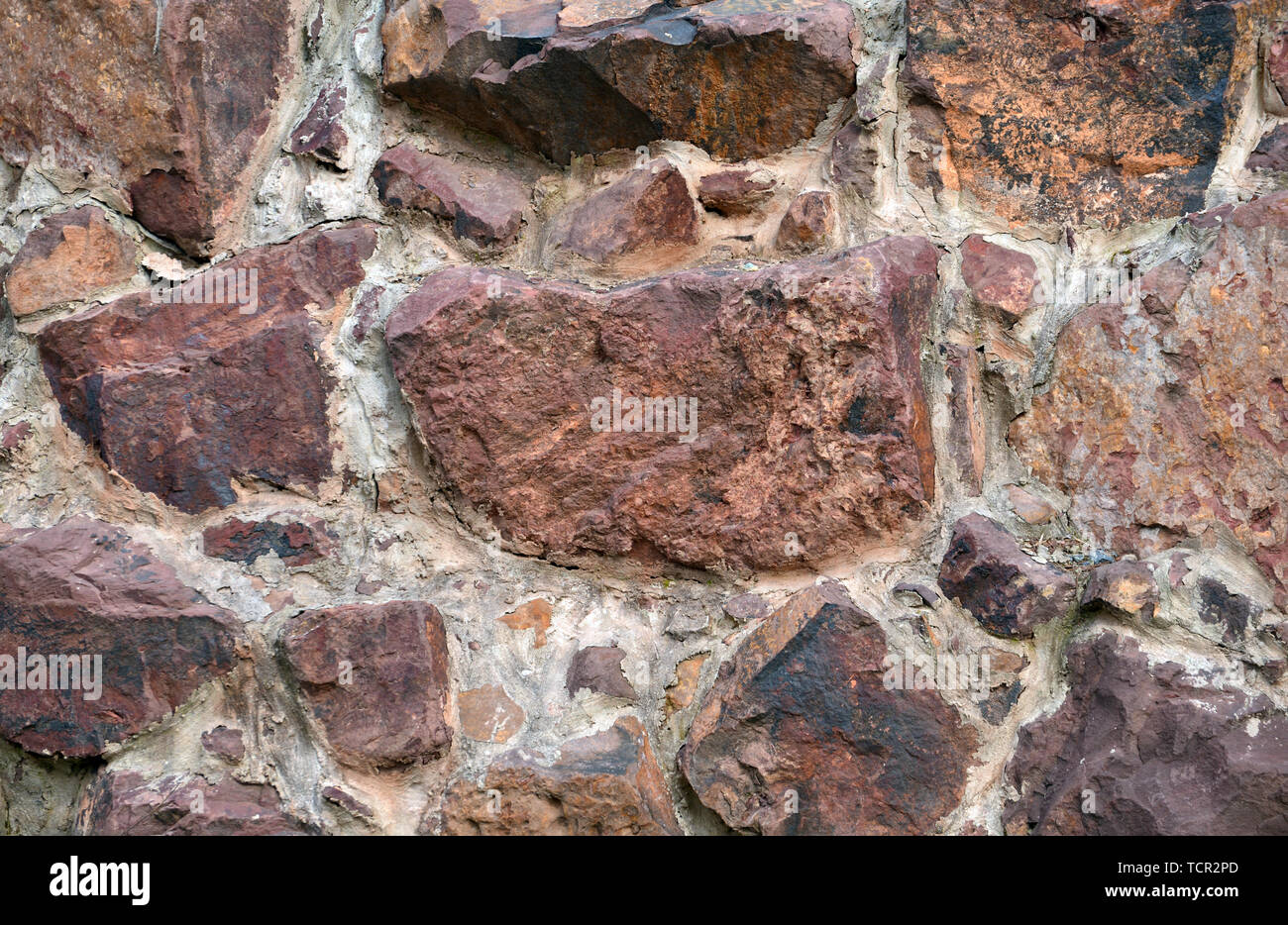 Rough stone wall background Stock Photo - Alamy