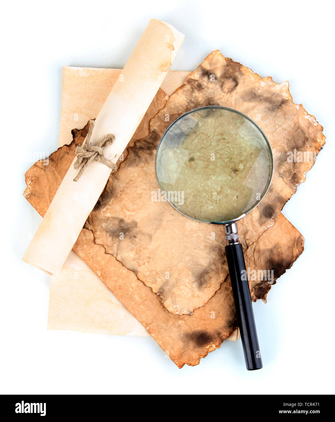 Old paper with magnifying glass isolated on white Stock Photo - Alamy