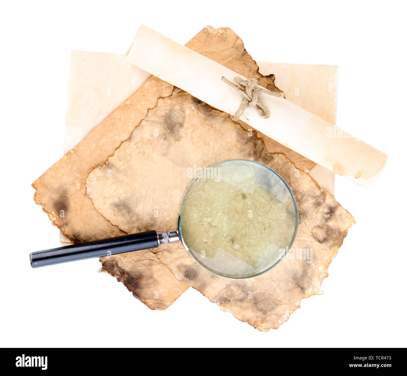 Old paper with magnifying glass isolated on white Stock Photo - Alamy