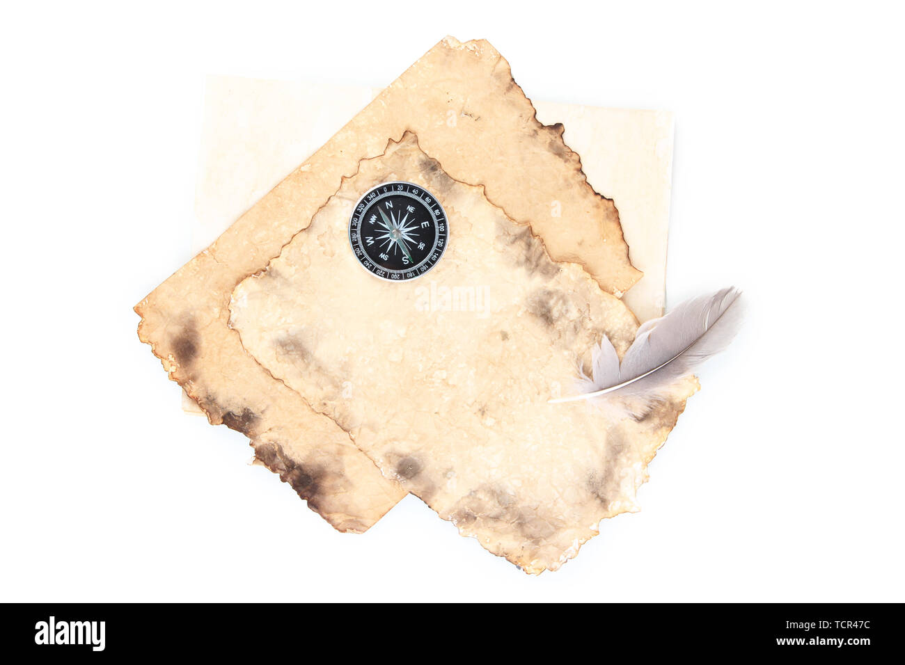 Old paper with compass and pen isolated on white Stock Photo - Alamy