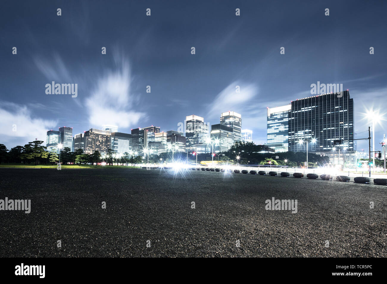 traffic on road in midtown of modern city at twilight Stock Photo - Alamy
