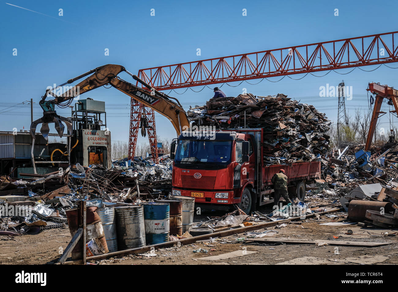 People who come to sell waste products in a waste recycling factory in ...