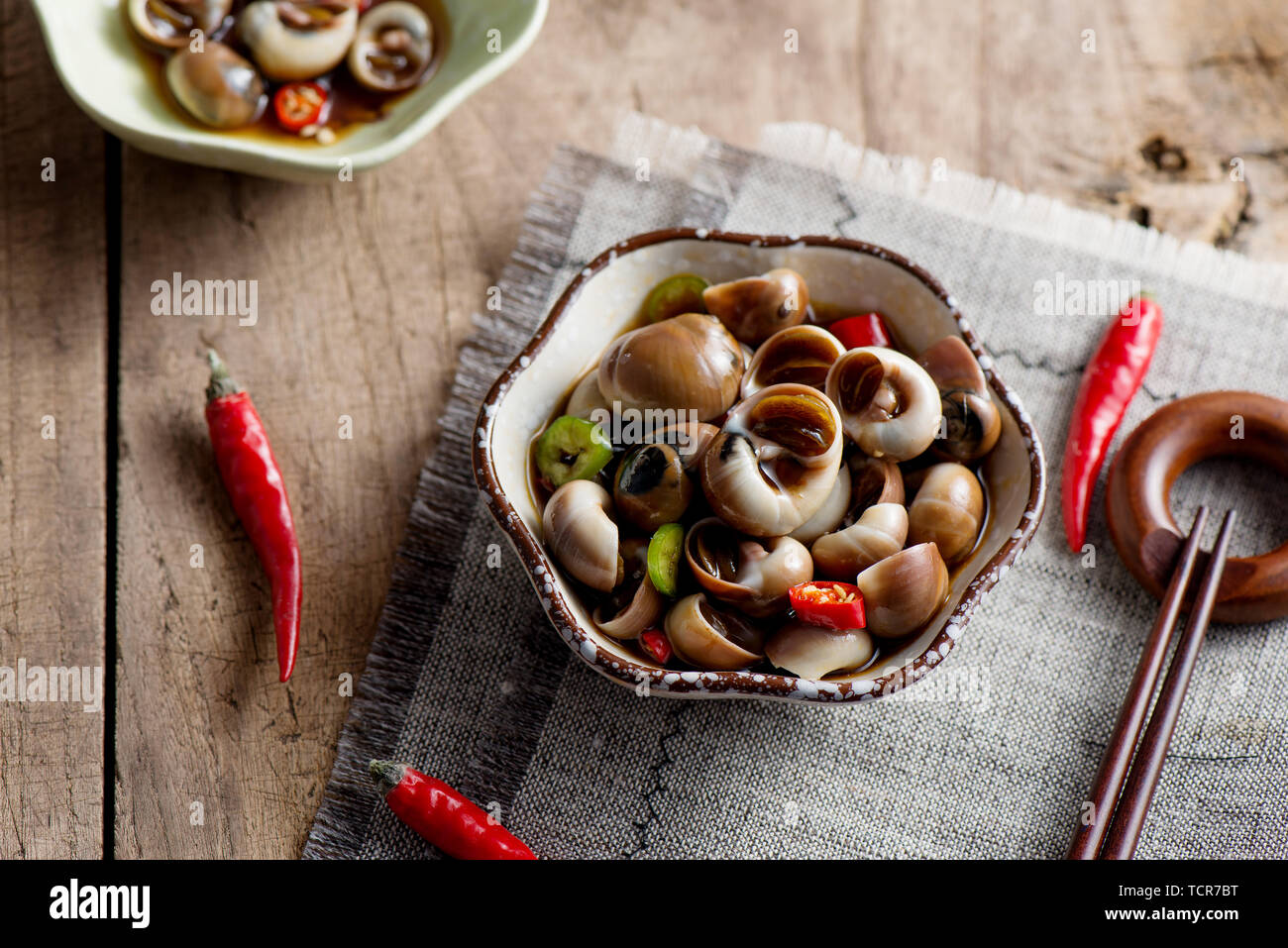 Spicy seafood sea melon seeds snail crab pliers Stock Photo - Alamy