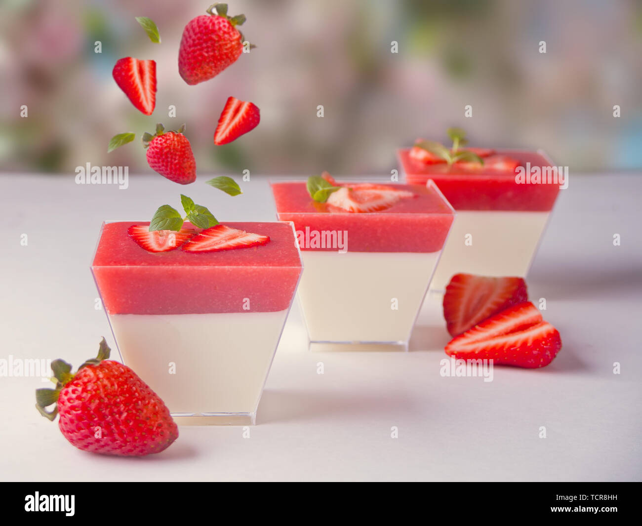 Dessert panna cotta with fresh flying berries on nature background ...