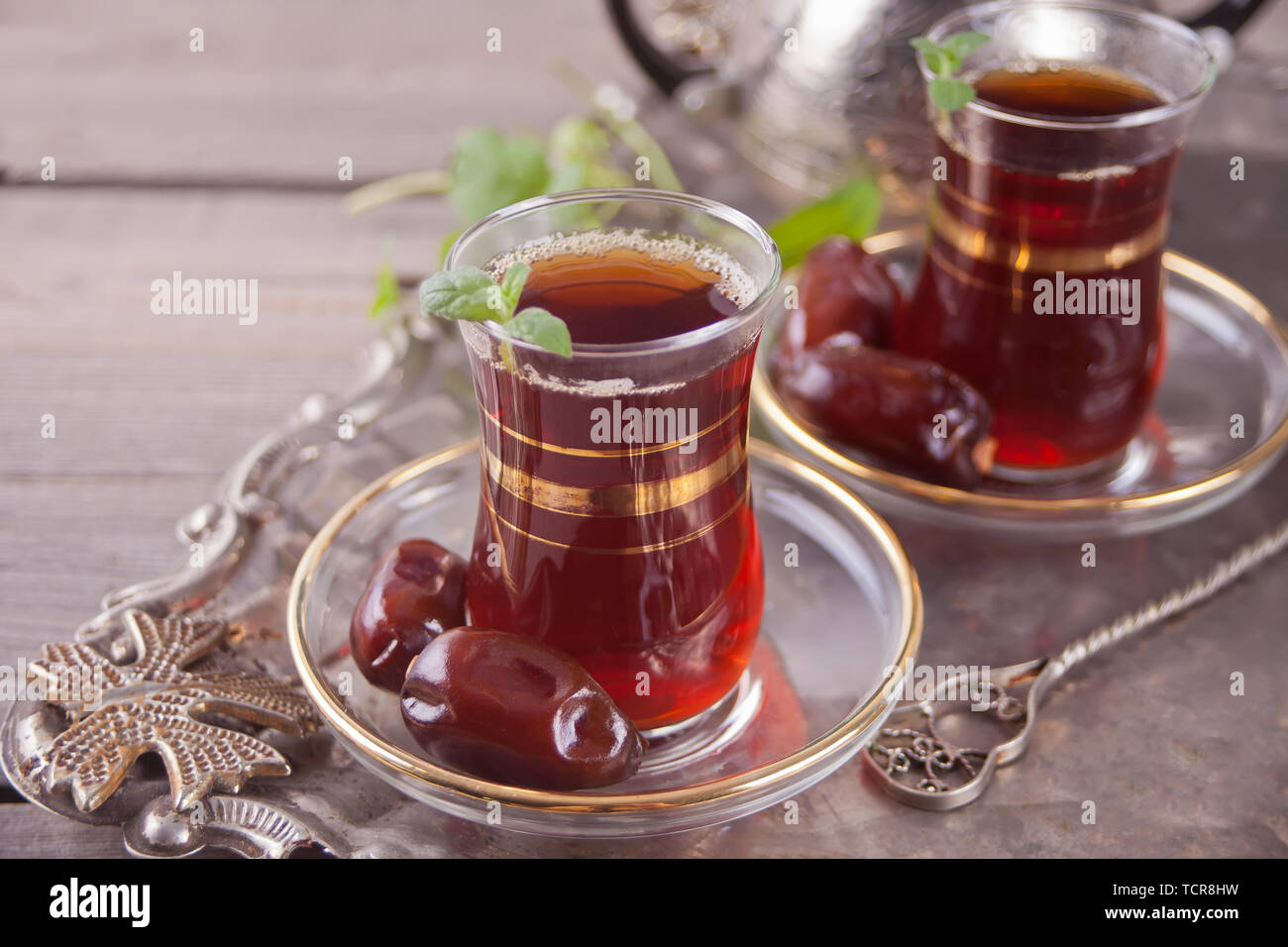 Turkish tea in traditional glass cups on the metal tray. Oriental Stock ...