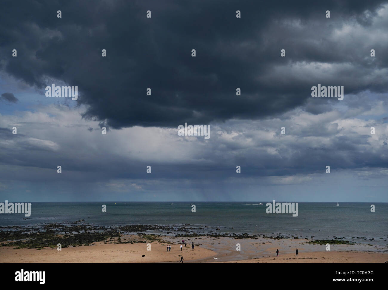 Rain clouds over Whitley bay beach Stock Photo - Alamy