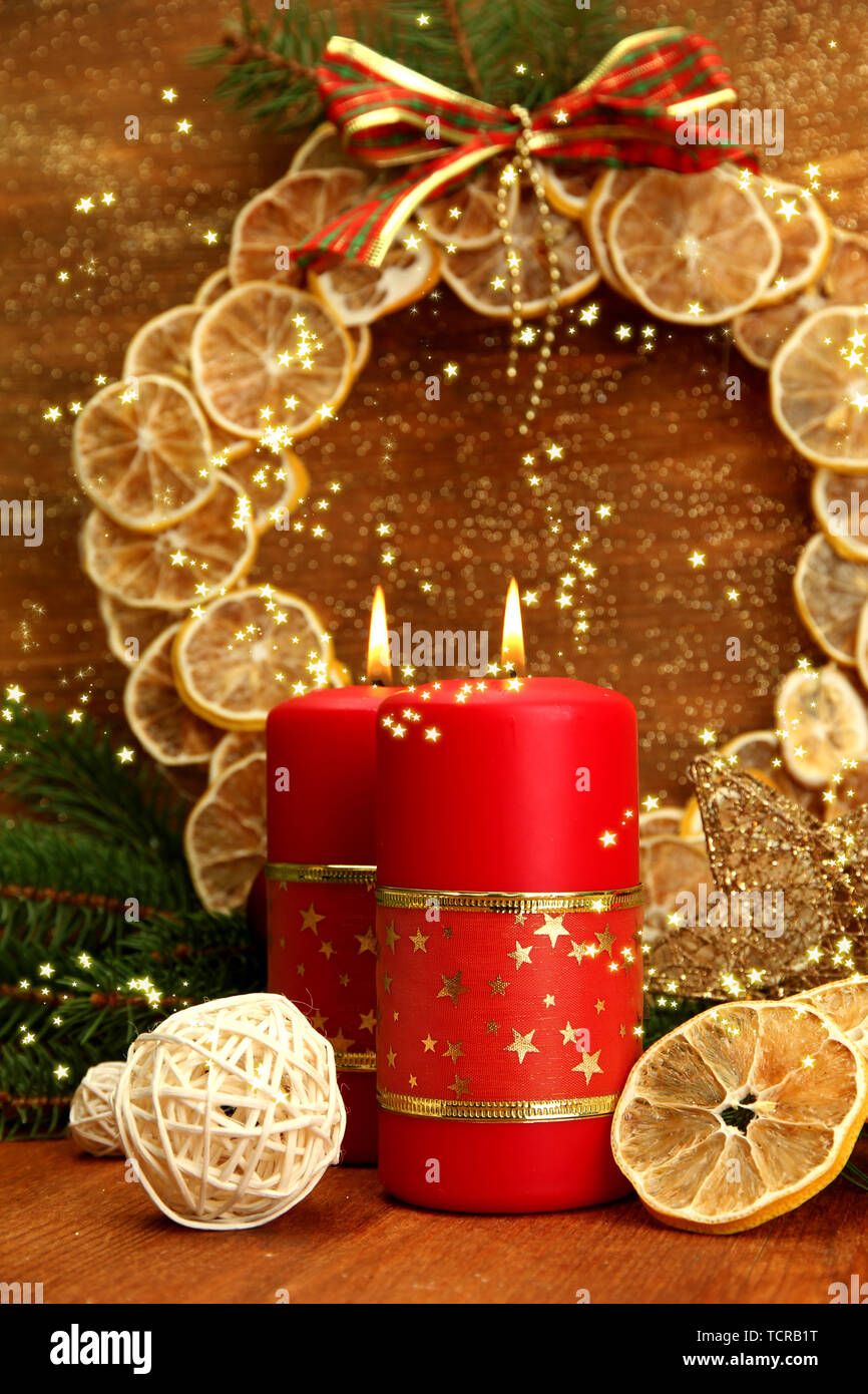 Two candles and Christmas decorations, on golden background Stock Photo ...