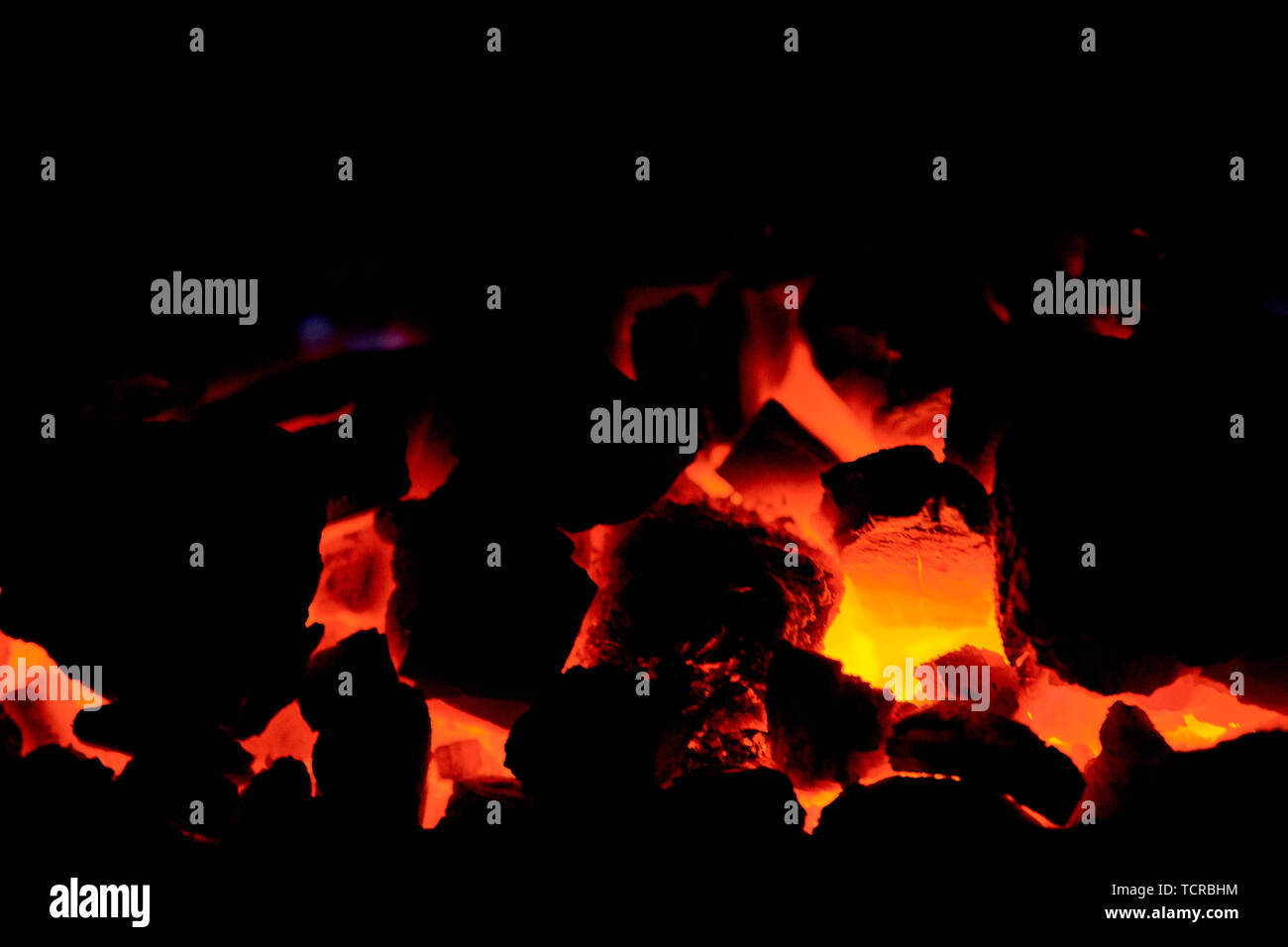 Coal anthracite. Burning coal in the furnace of a solid fuel boiler ...
