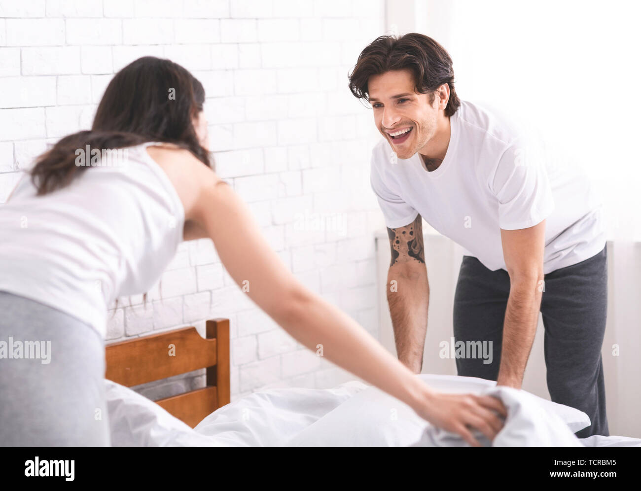 Young couple making love bed hi-res stock photography and images - Alamy