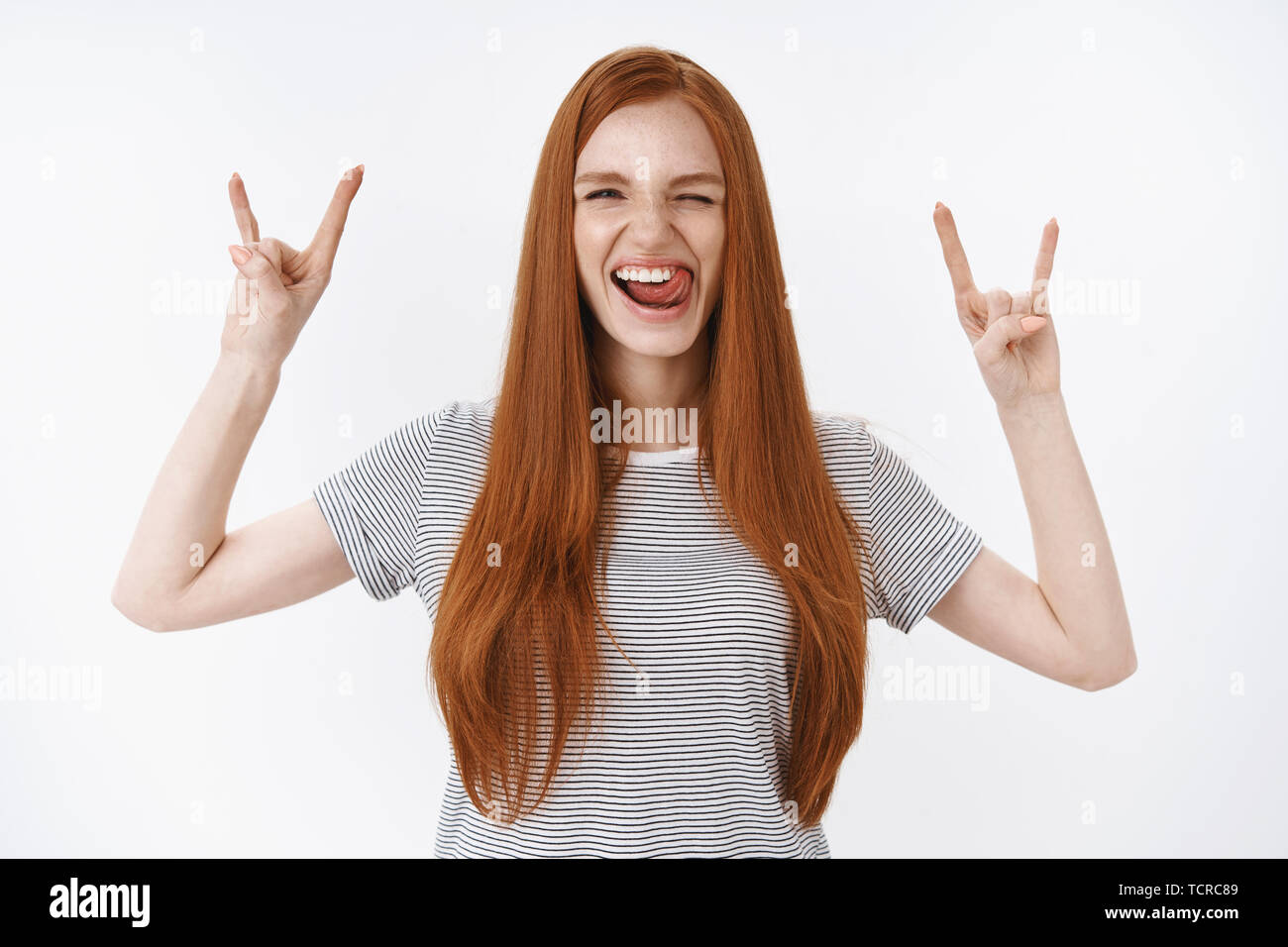 Waist-up shot lively cool cheerful redhead amused teenage girl stick ...