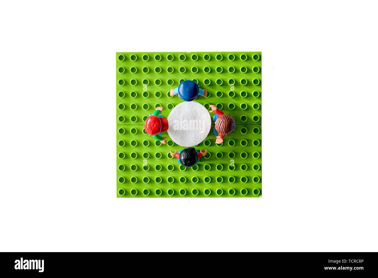 Lego people around the table, combine from different set Stock Photo ...