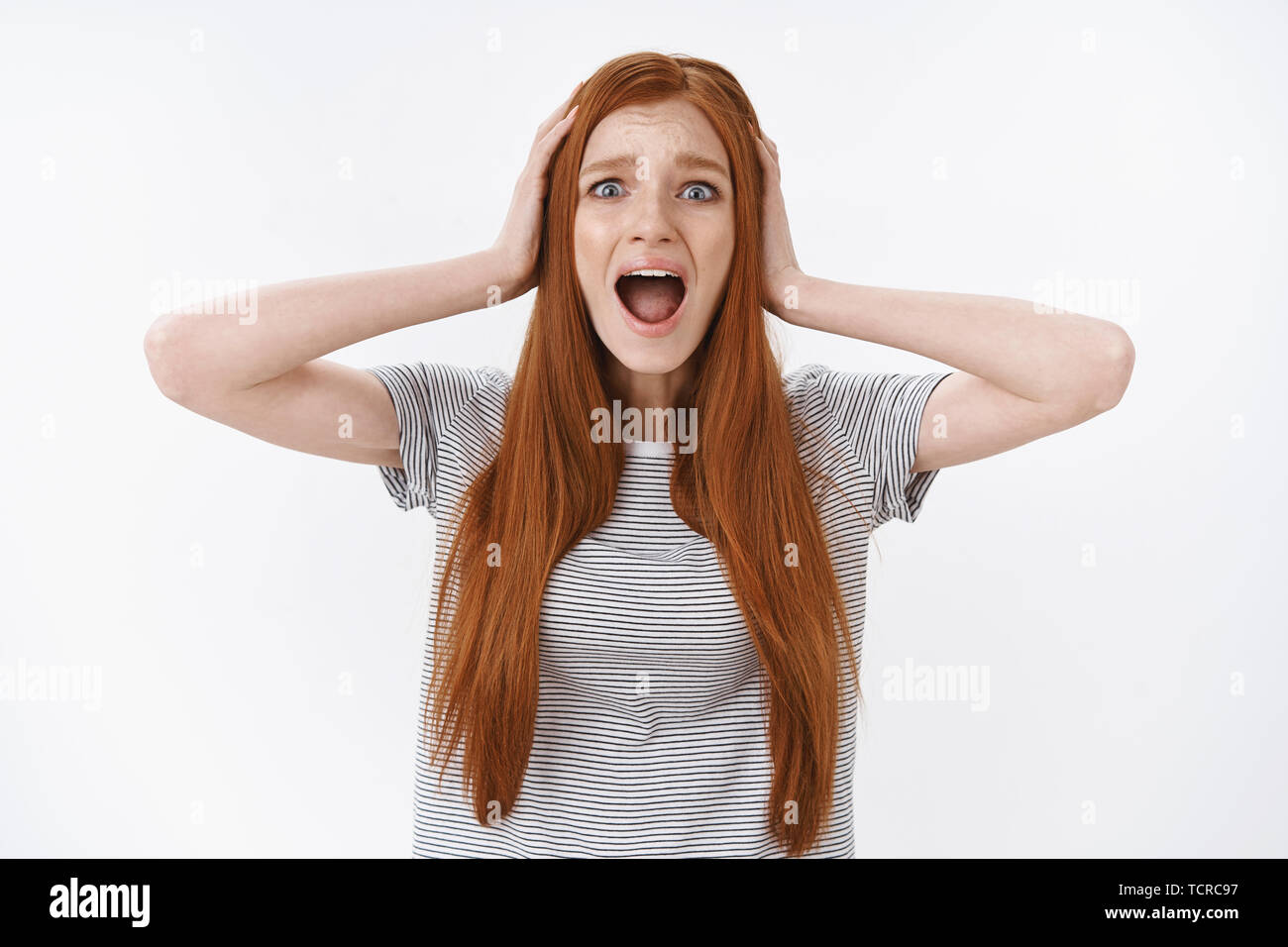 Freaked out shocked disappointed redhead girl screaming displeased ...