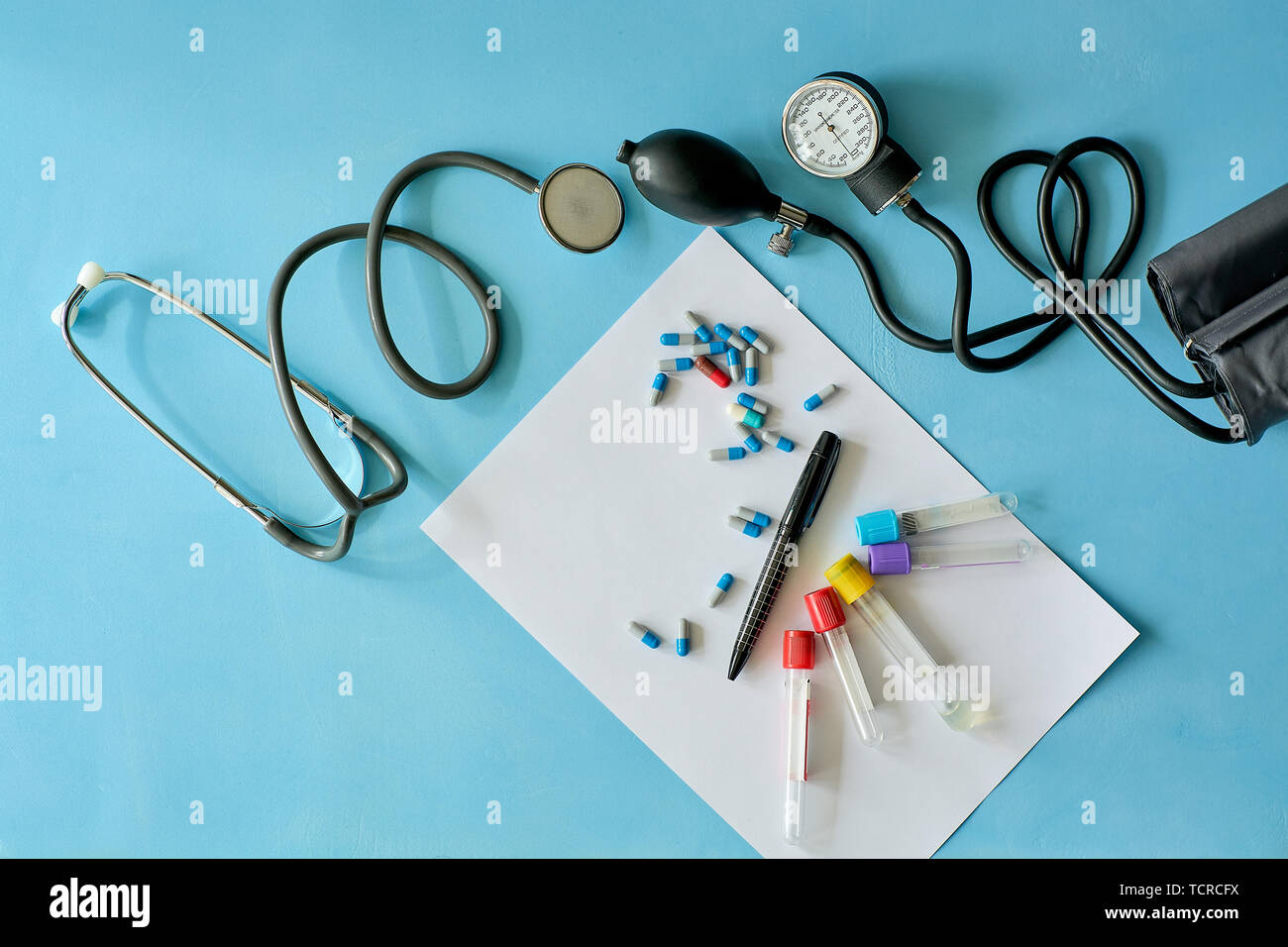White sheet paper with black pen and colored different pills Stock ...