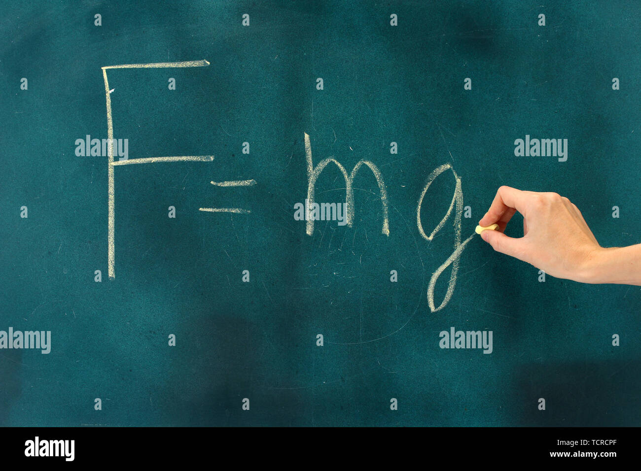 Physics formula written on blackboard with chalk Stock Photo - Alamy