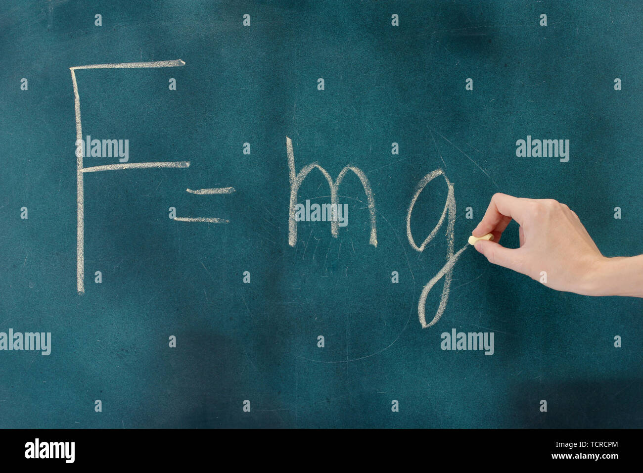 Physics formula written on blackboard with chalk Stock Photo - Alamy