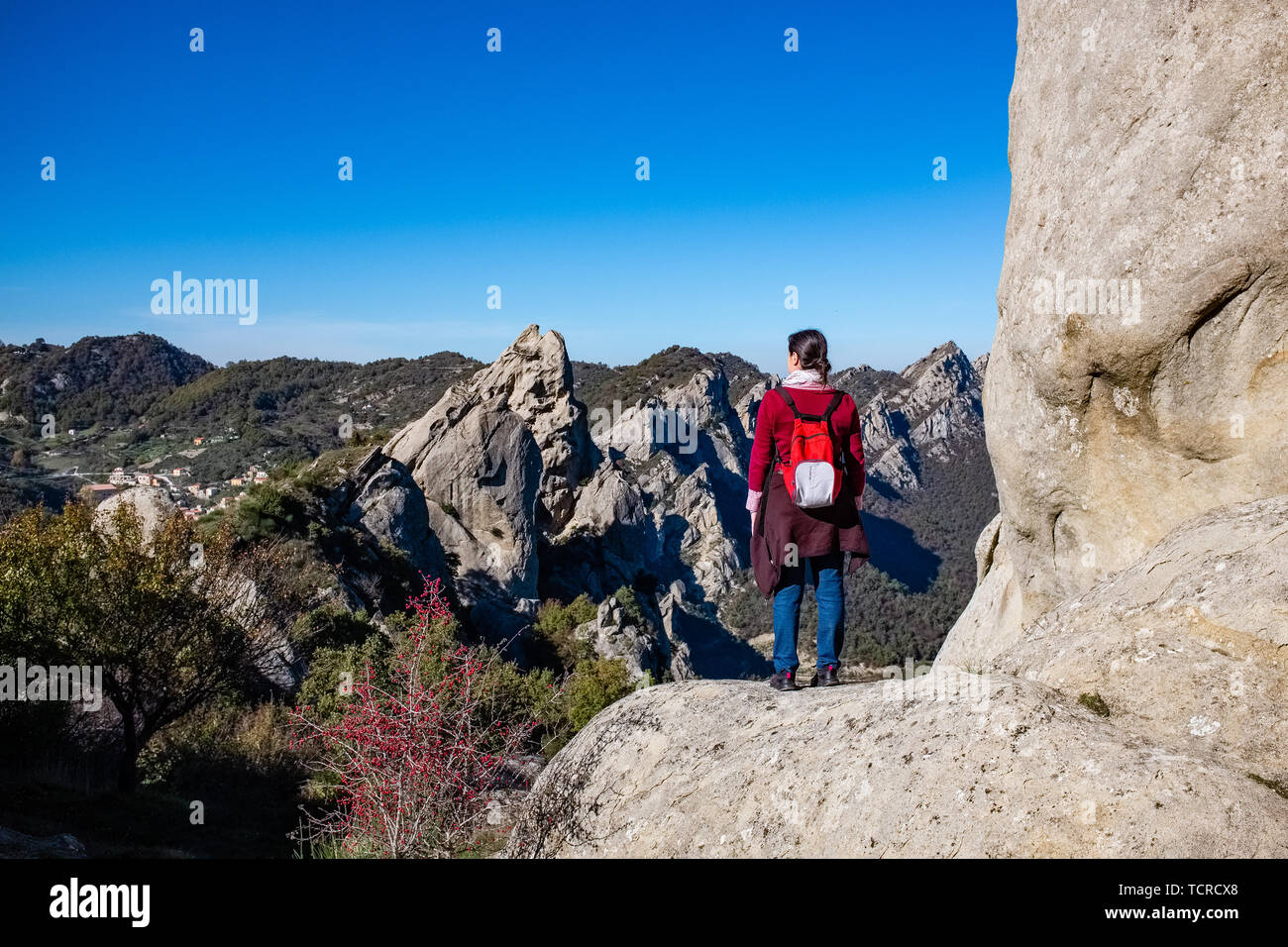 Woman admires the landscape of Dolomites of Basilicata mountains called ...