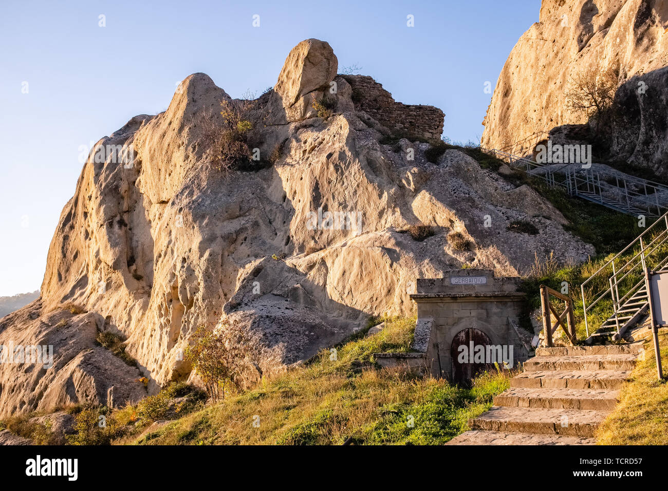 Ruins of Castelmezzano castle and gate of water reservoir. Dolomites of ...