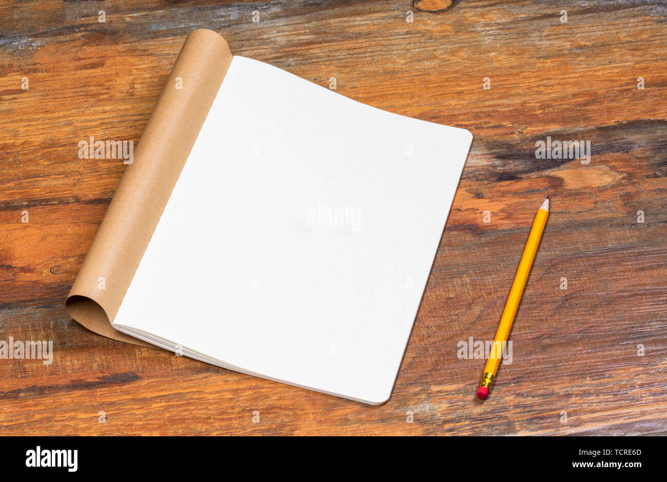 Blank notebook on your desk Stock Photo - Alamy