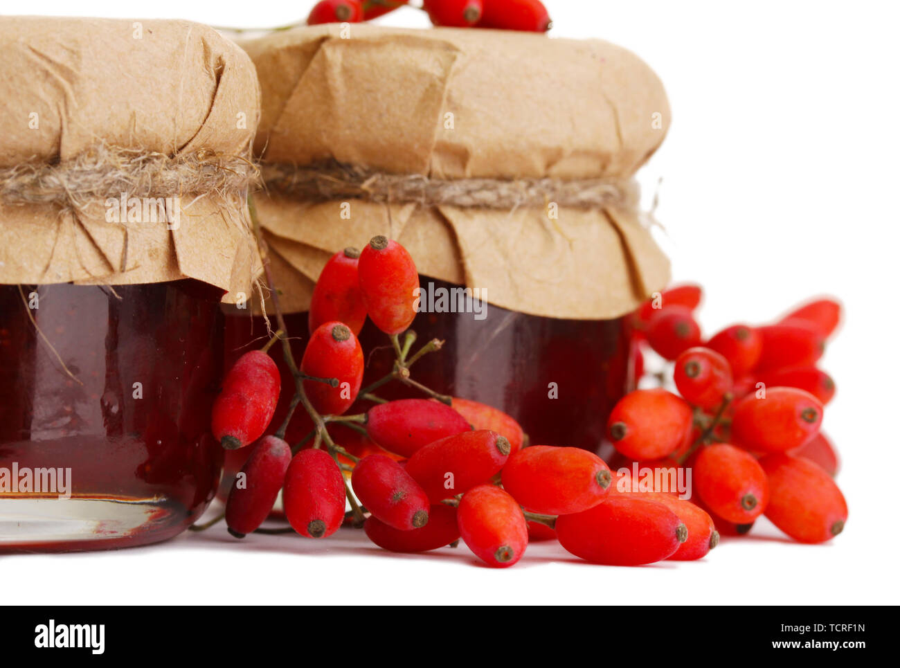 ripe barberries and jars of jam isolated white Stock Photo - Alamy